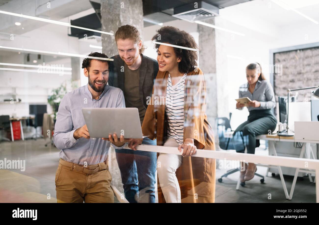 Programmers cooperating brainstorming at information technology company ...