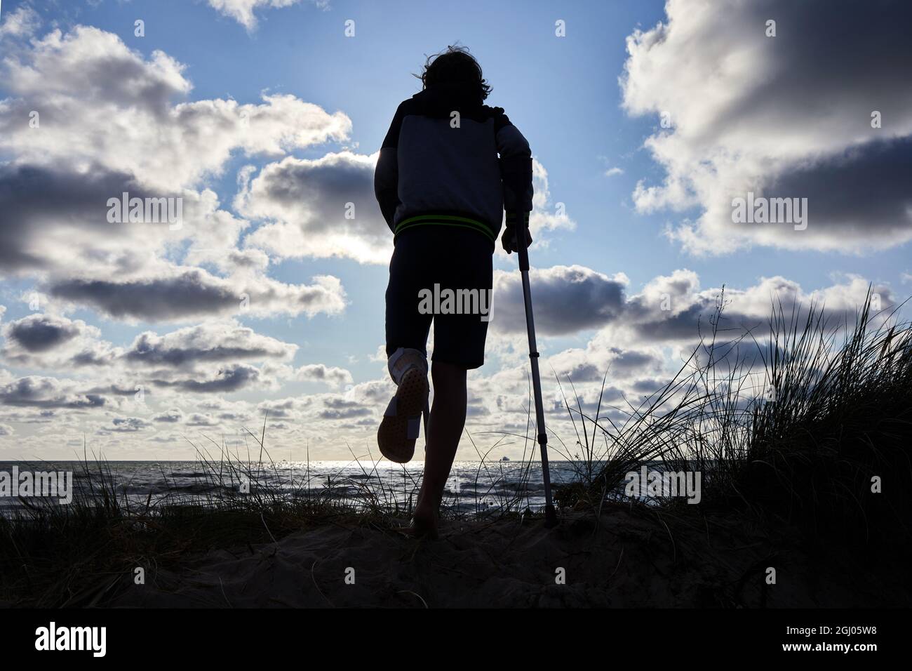 Person on crutches hi-res stock photography and images - Alamy