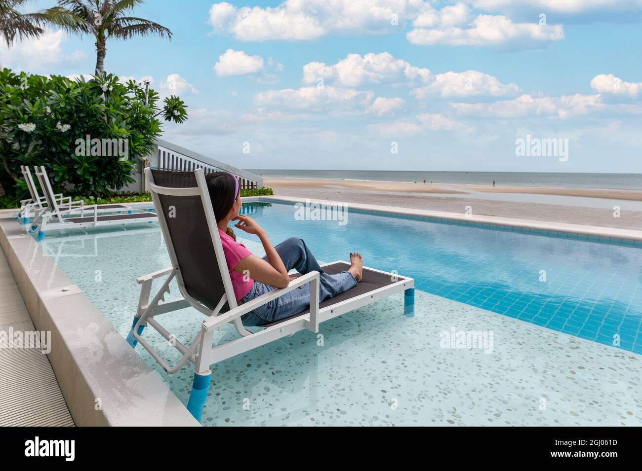 Girl sunbathing in lounge chair hi-res stock photography and images - Alamy