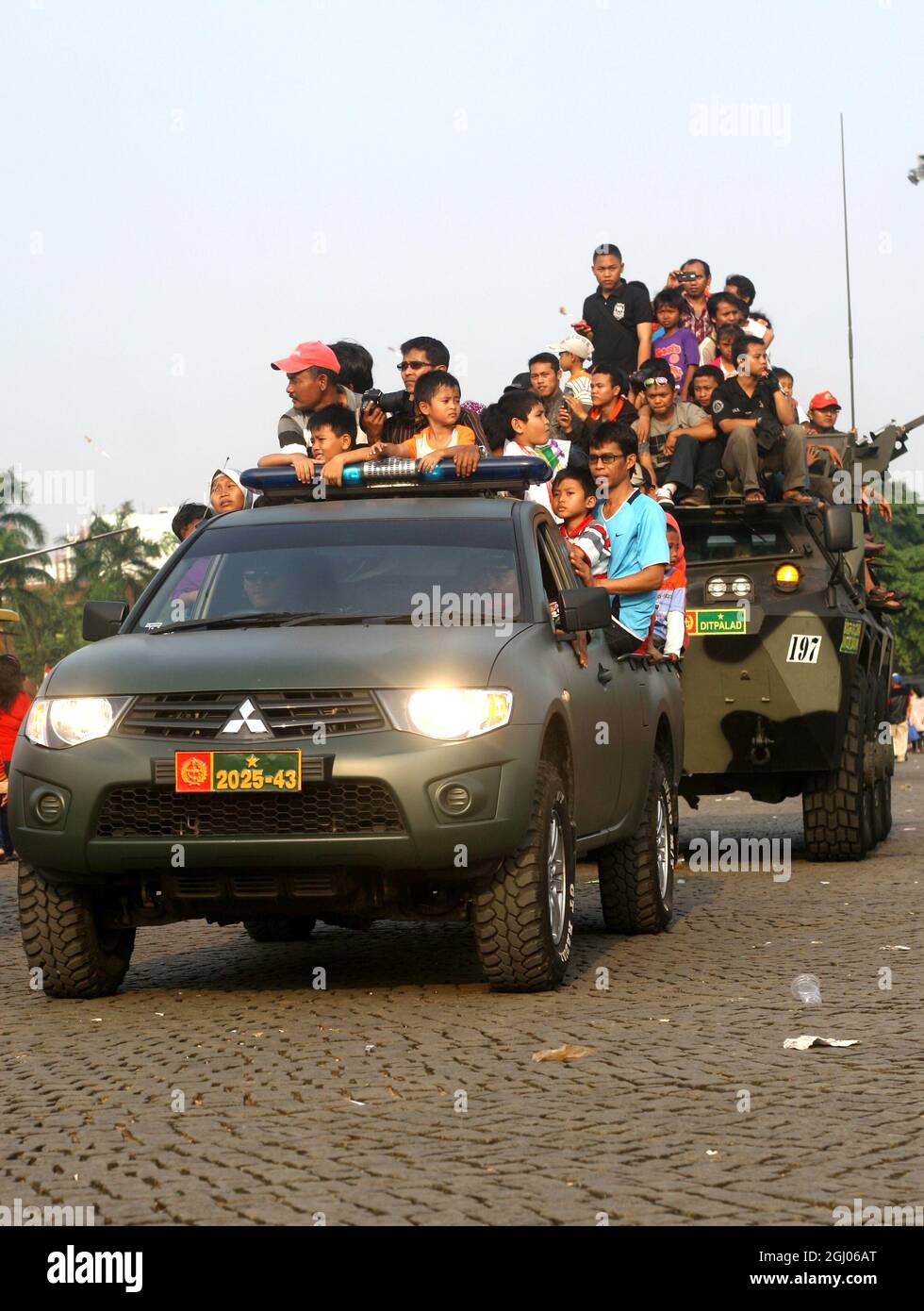 people ride tanks from the Indonesian army in a parade Stock Photo - Alamy