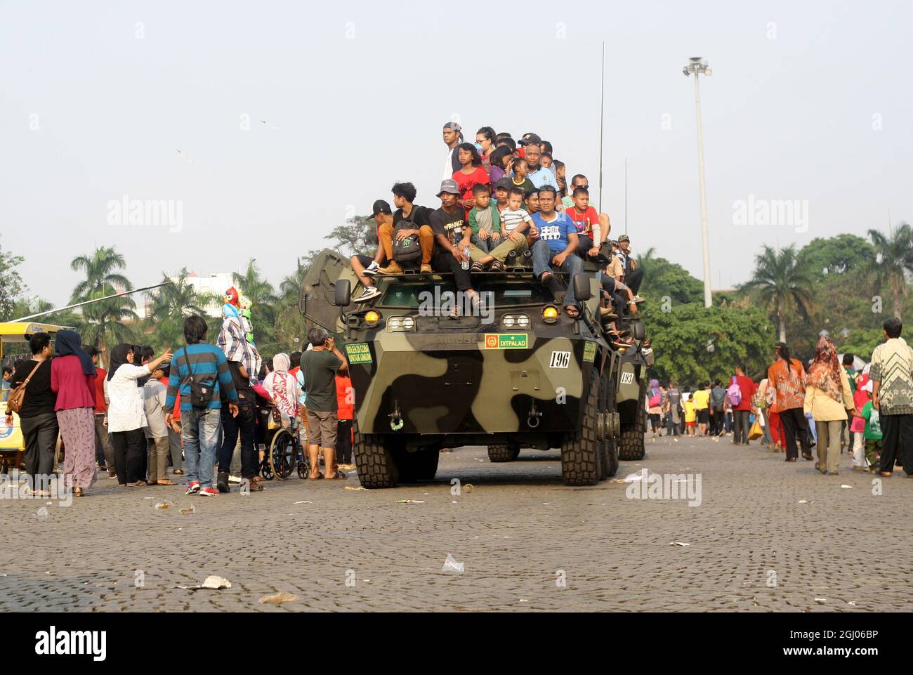 people ride tanks from the Indonesian army in a parade Stock Photo - Alamy