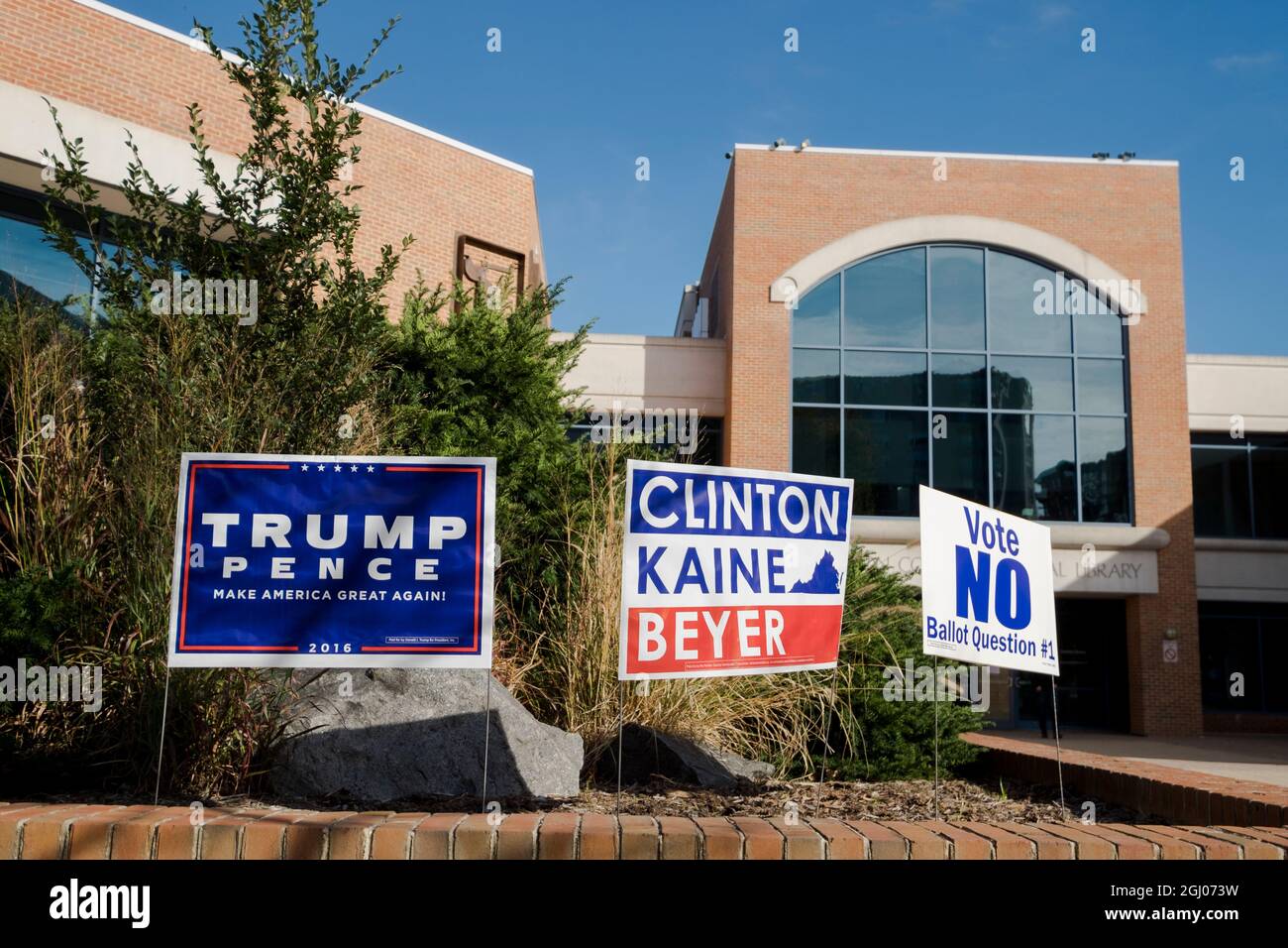 Campaign signs for Donald Trump, Hillary Clinton at a voting place on ...