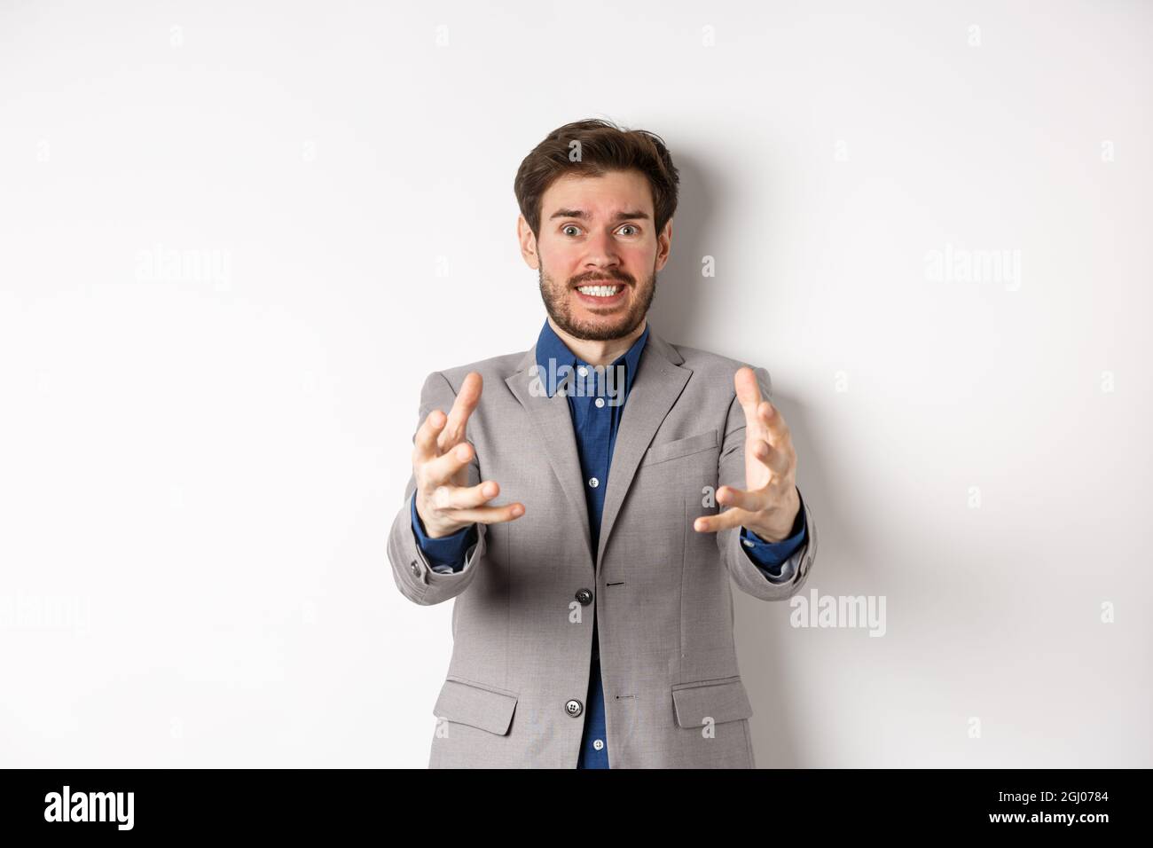 Distressed businessman stretch out hands to strangle annoying person ...