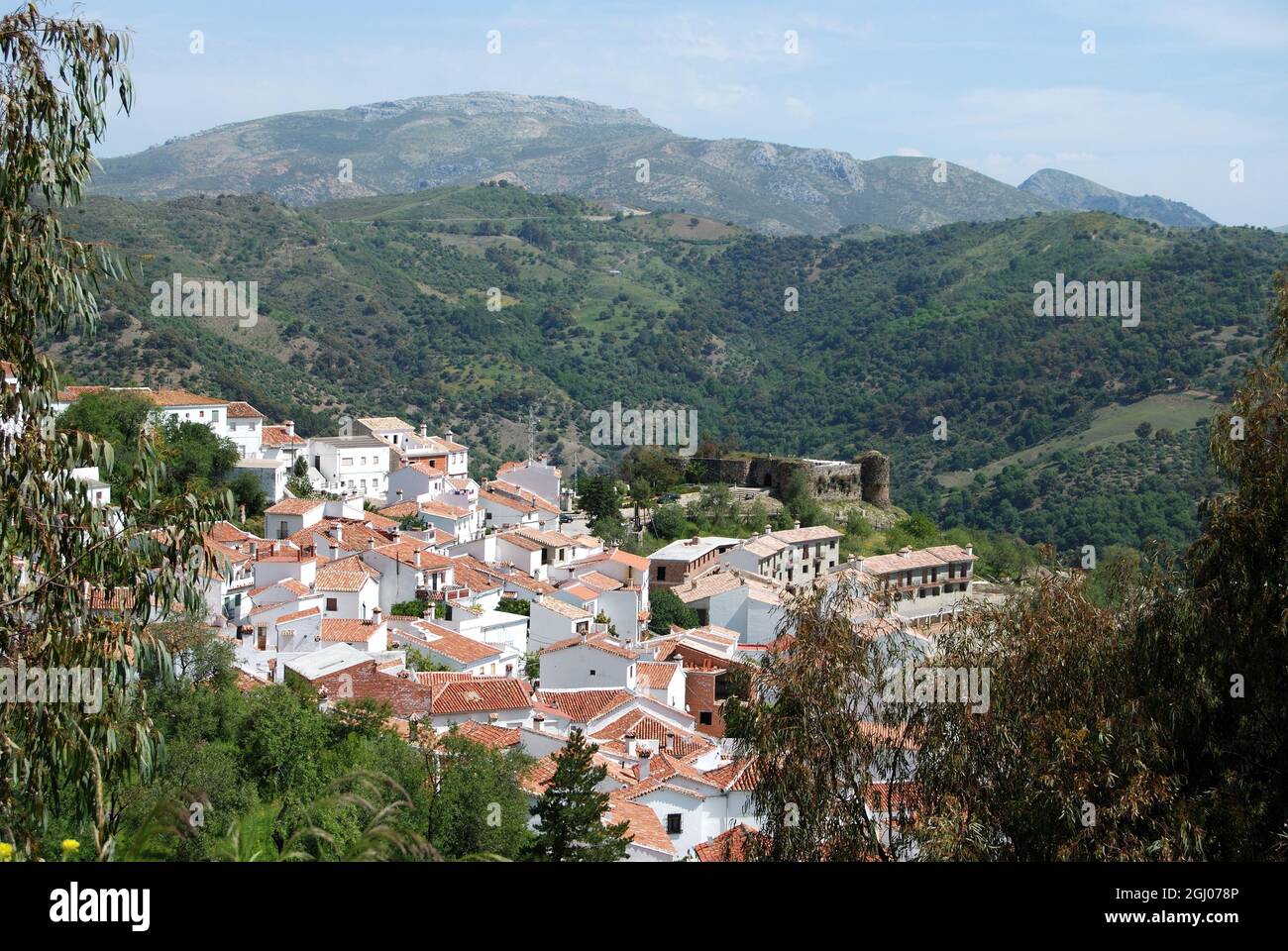 View over village rooftops towards the mountains, Benadalid, Malaga ...