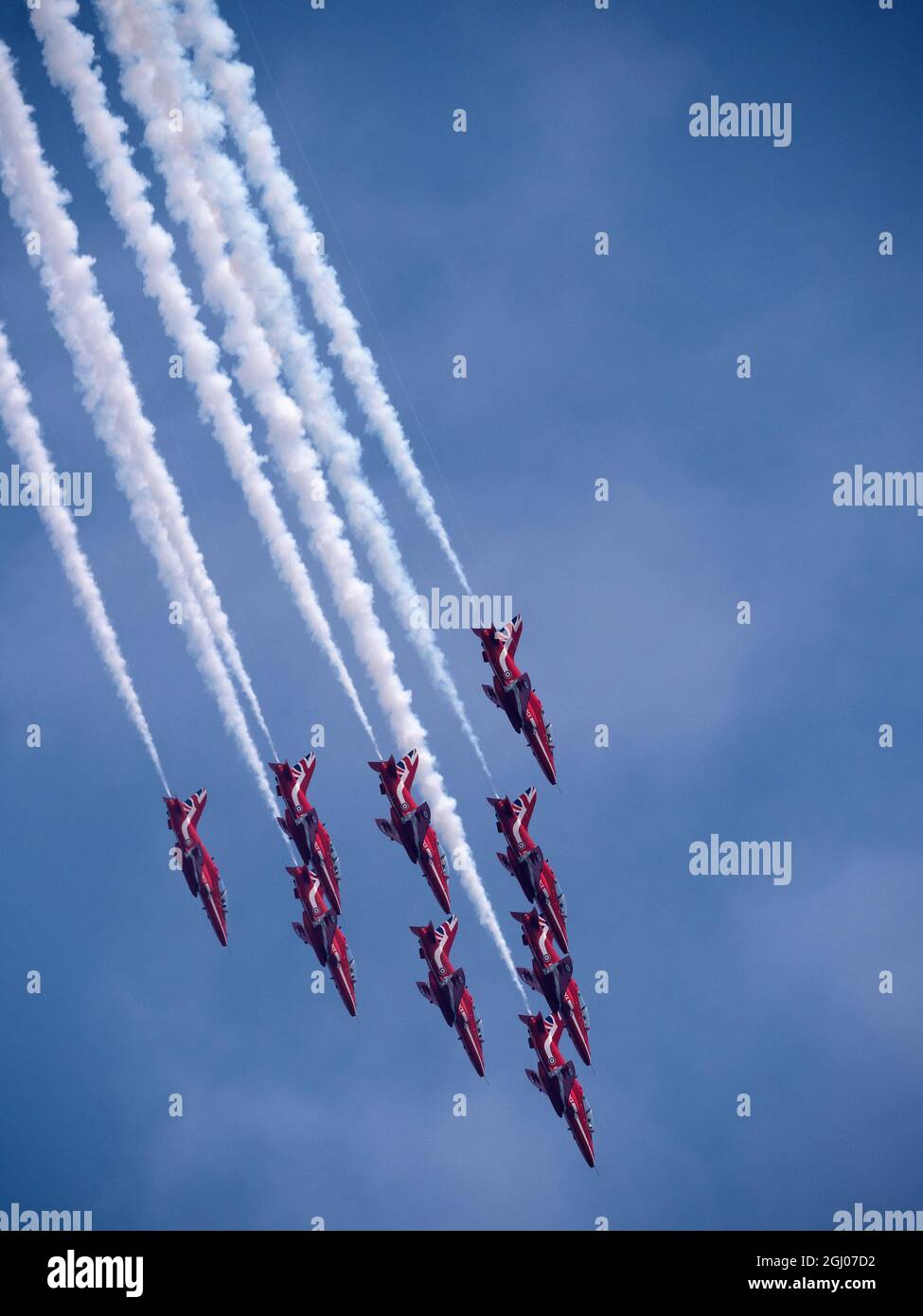 Red Arrows aerial display team descending in close formation Stock ...