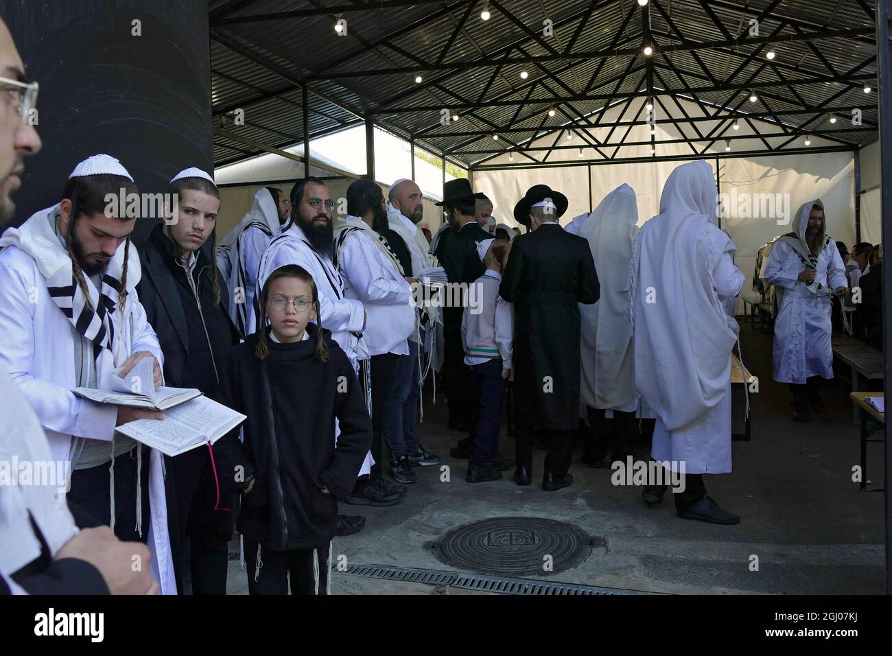 UMAN, UKRAINE - SEPTEMBER 7, 2021 - Men are seen in the street as ...