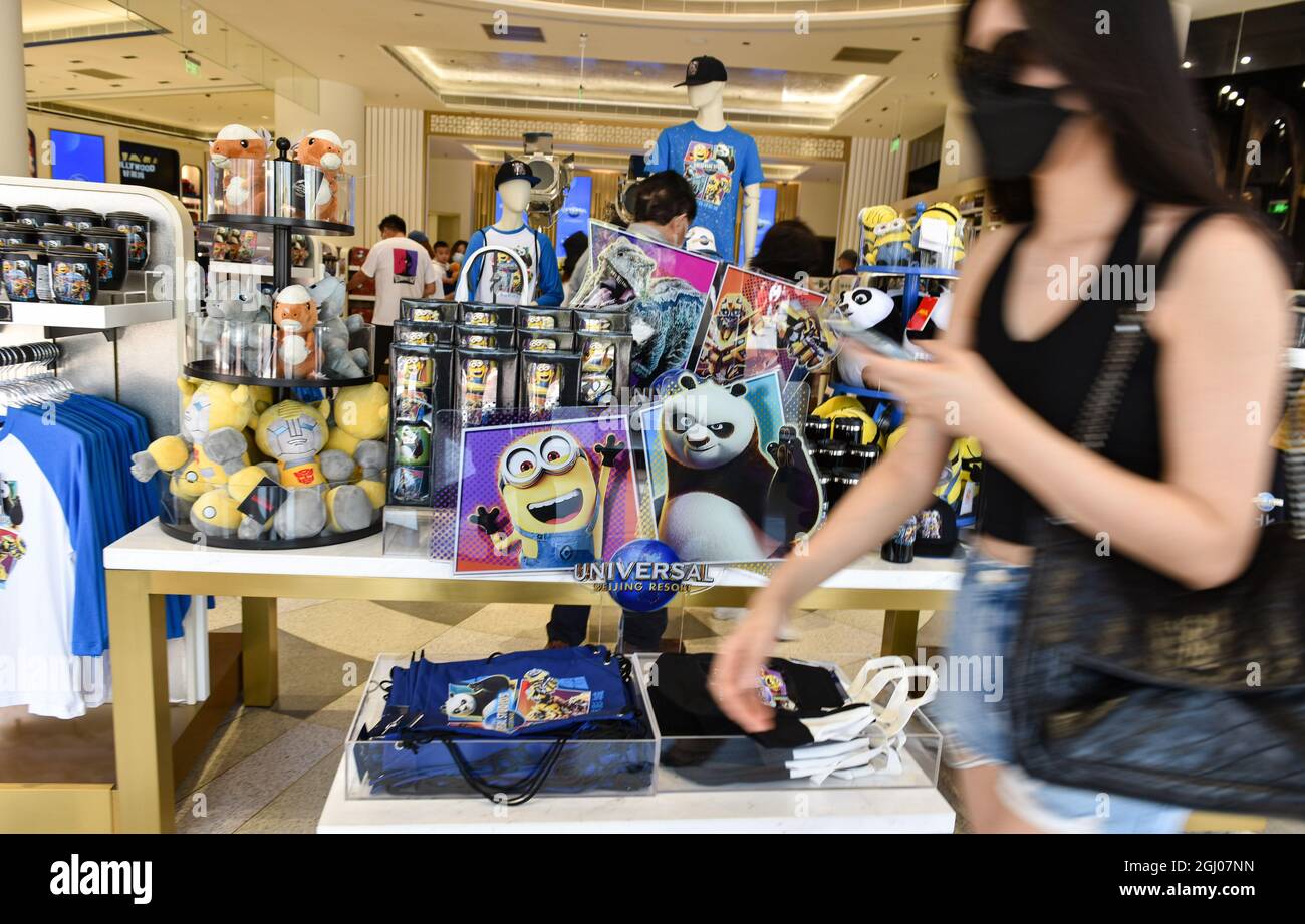 Tourists are seen shopping at a souvenir shop in Beijing Universal ...