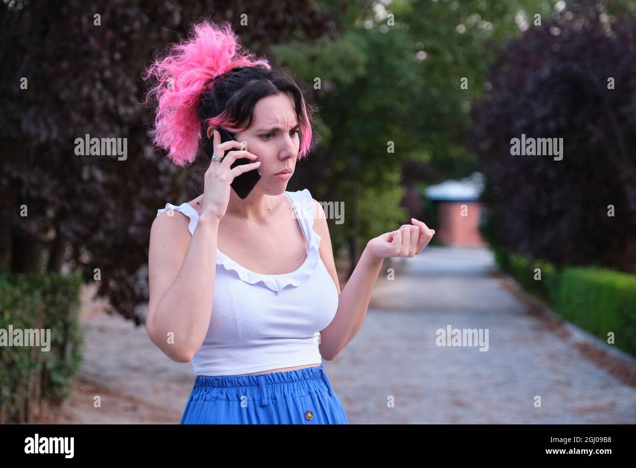Talking smart phone frown hi-res stock photography and images - Alamy
