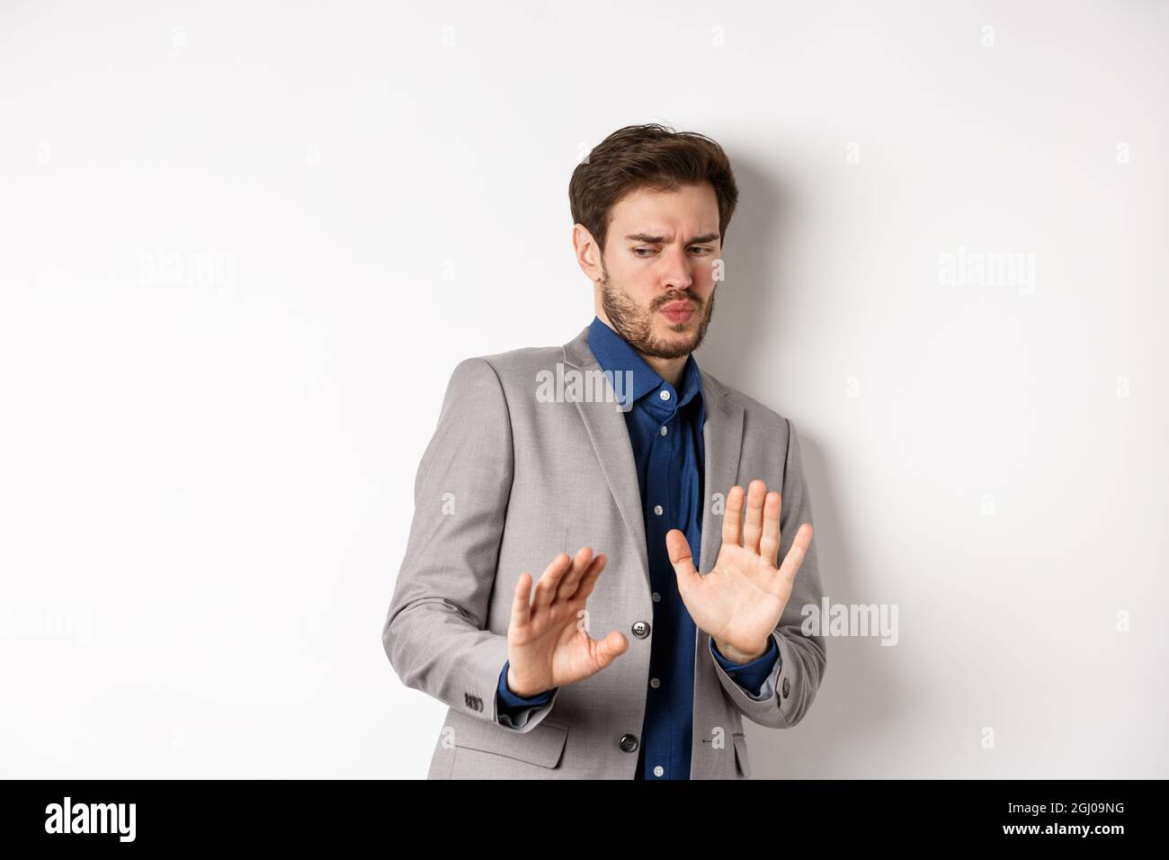 Stay away. Reluctant businessman step back with concerned disgusted ...