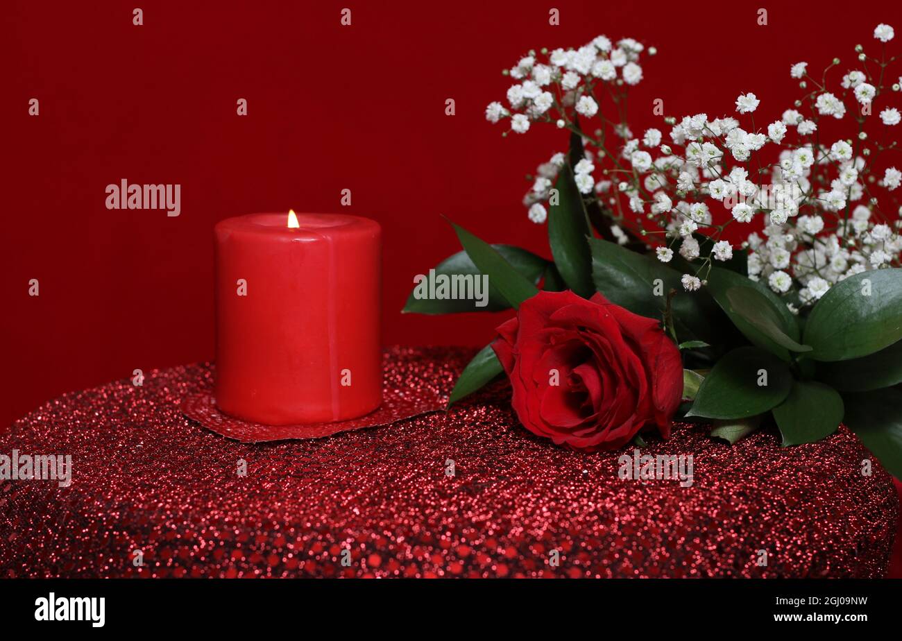 Red Rose With Red Candle on Red Velvet Background Stock Photo - Alamy