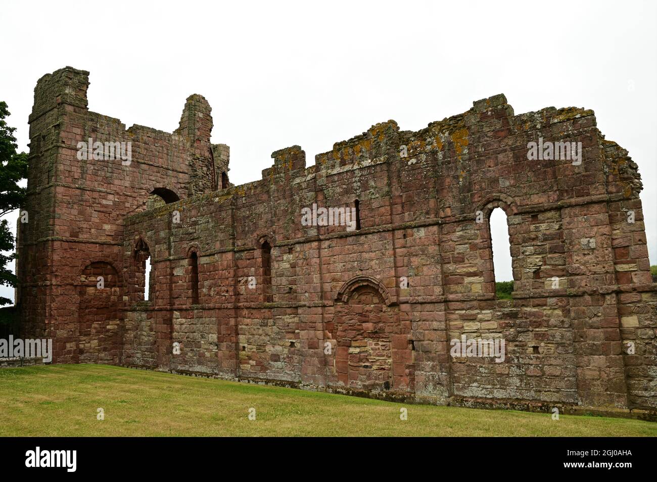 An external view of the ruins of a medieval priory building on the ...