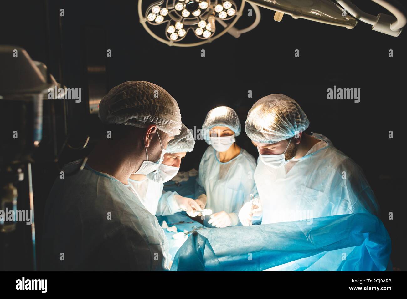 The senior surgeon in the operating room, where the patient is waiting ...