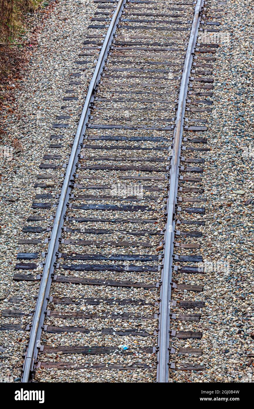 Route rails viewed from above. Metal and wood on a backdrop of small ...
