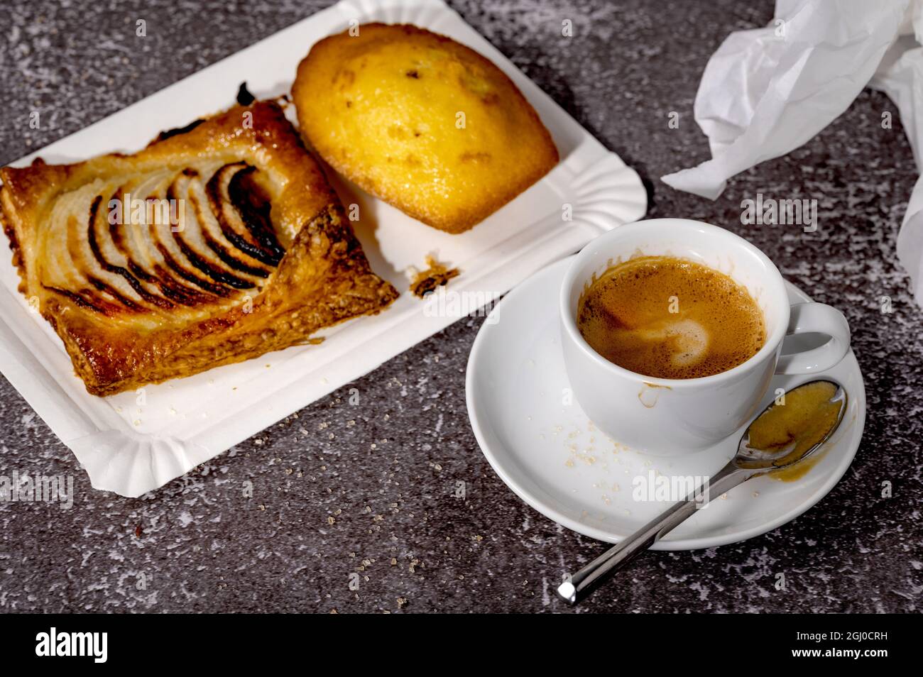 Closeup shot of a cup of cappuccino and pastry on a table Stock Photo ...