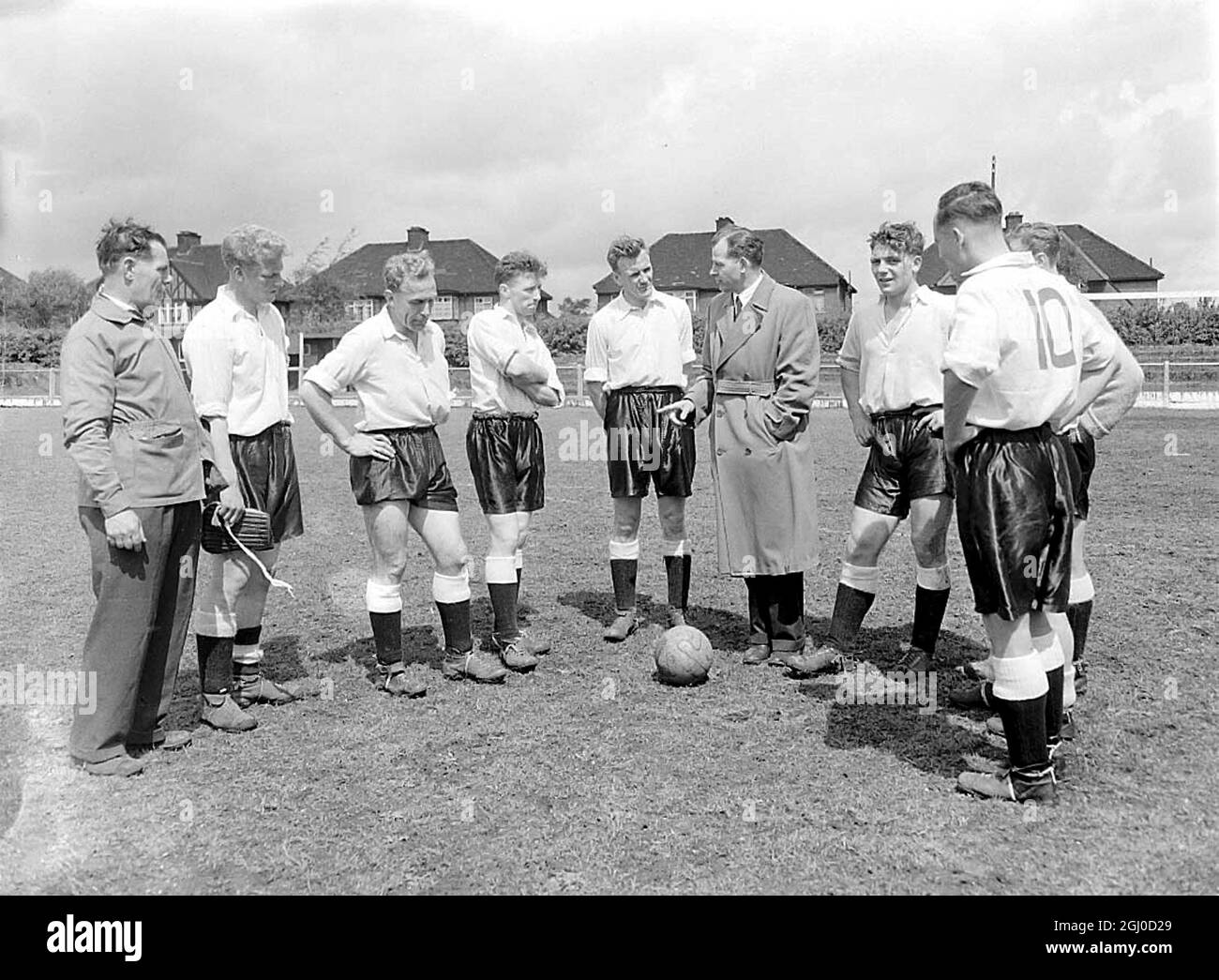 Having a tactical talk on the Finchley Football ground are the England ...