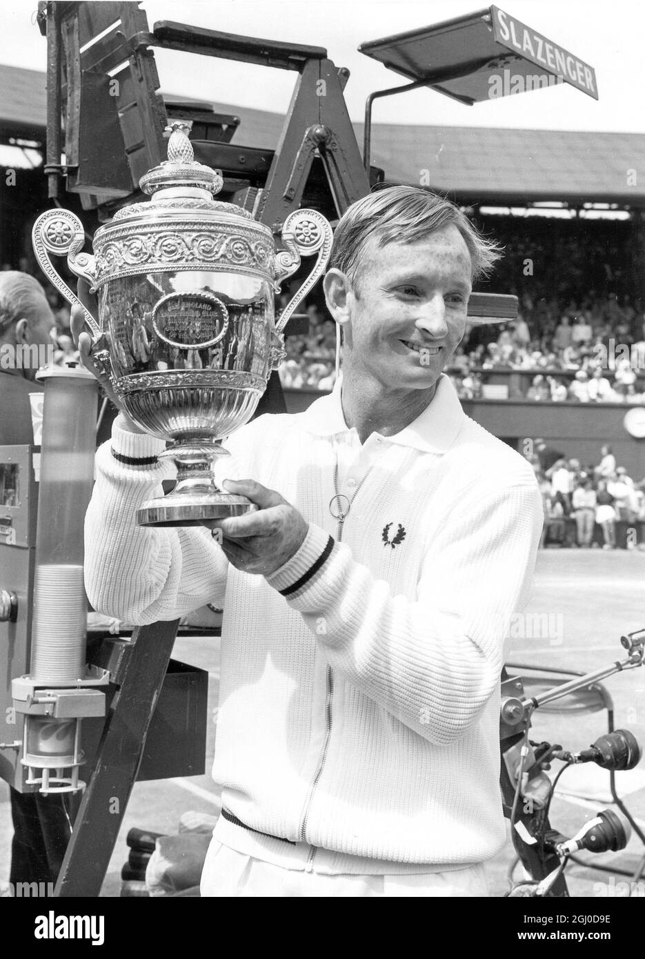 Rod Laver holds up his Trophy at Wimbledon after winning the mens ...