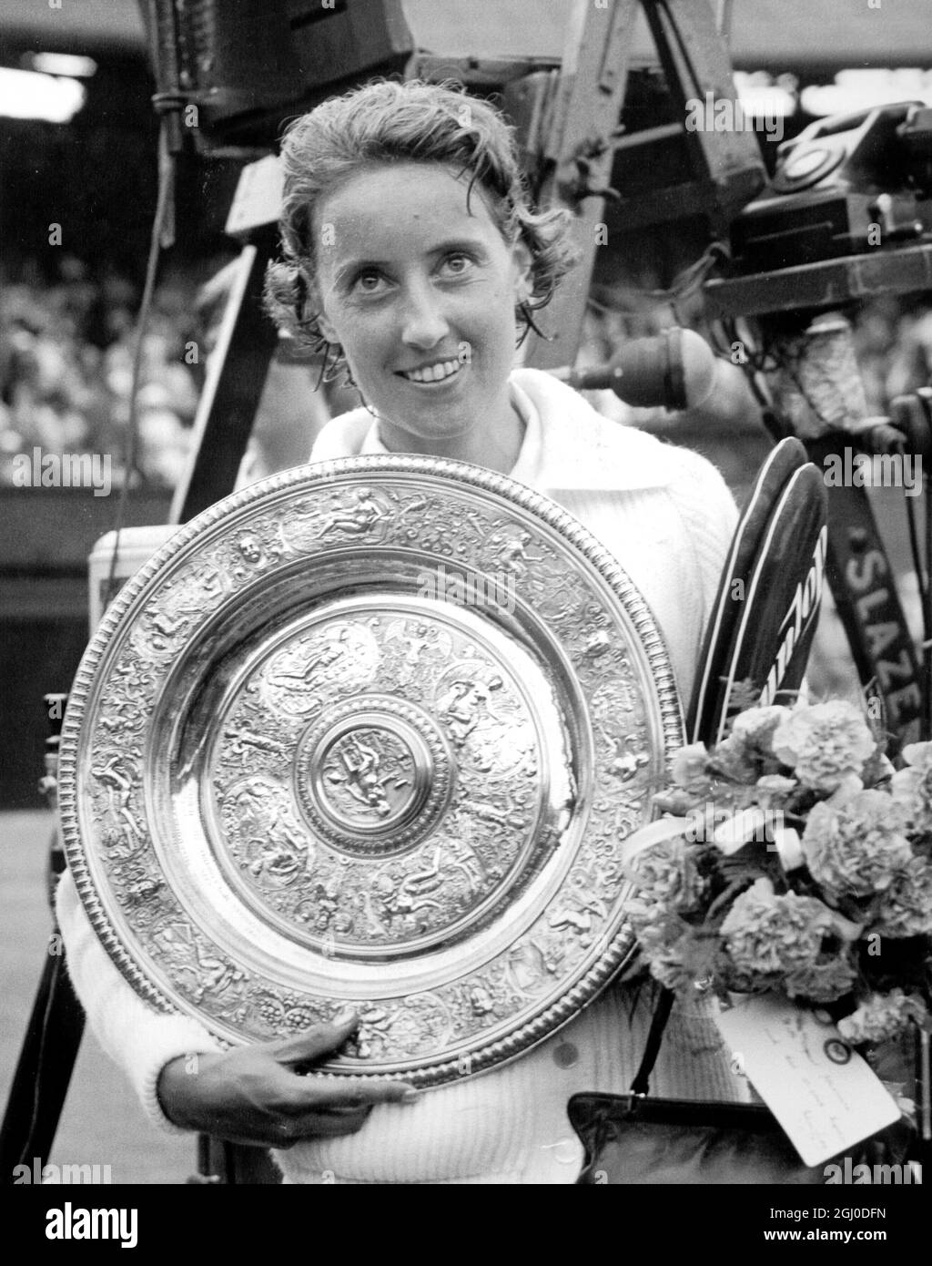 Angela Mortimer hold the ladies singles championship trophy after her ...