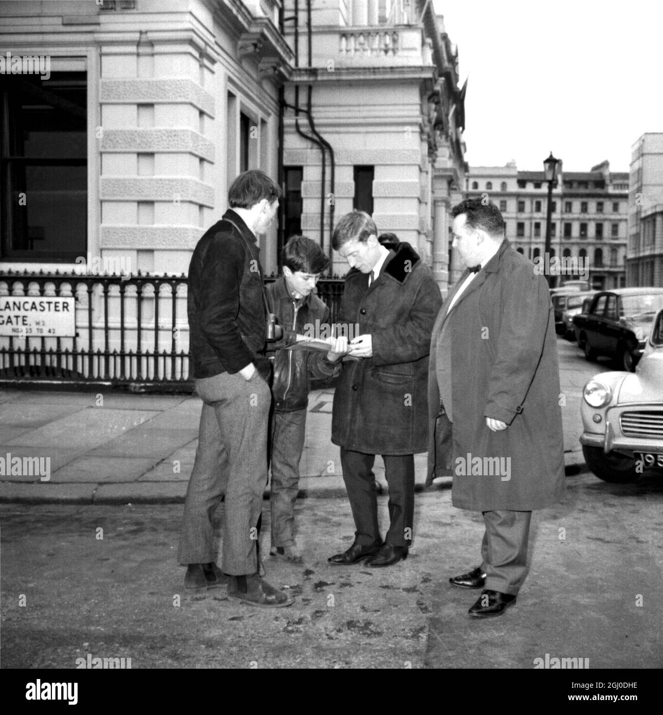Former England International soccer defender Tony Kay (2nd right) gives ...