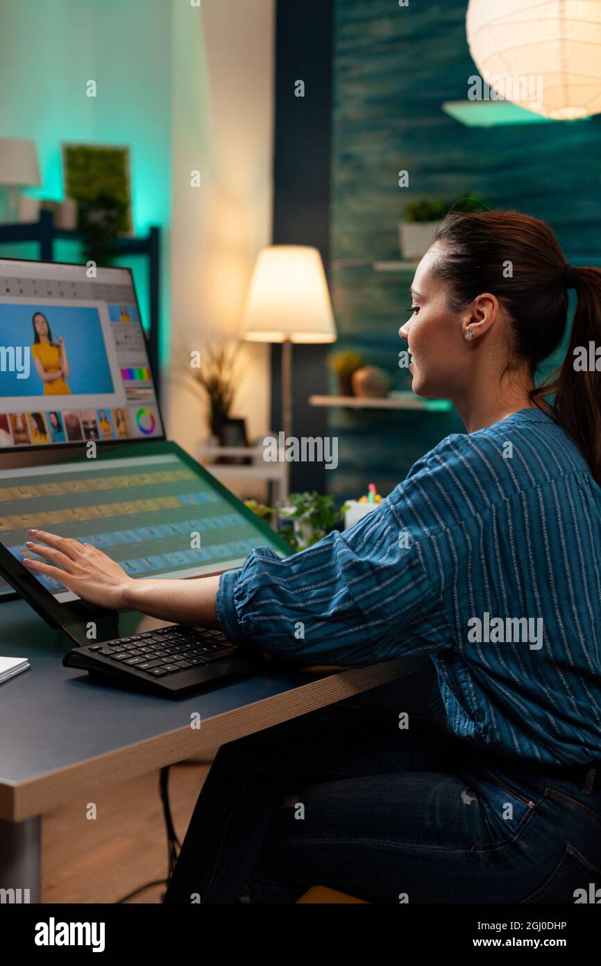 Photo editing specialist working as graphic designer at office doing ...