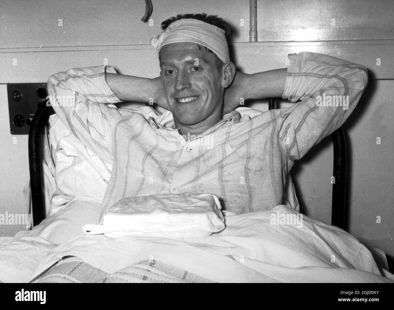 Tony Kay, Sheffield Wednesday team captain who has a scalp wound, sits ...