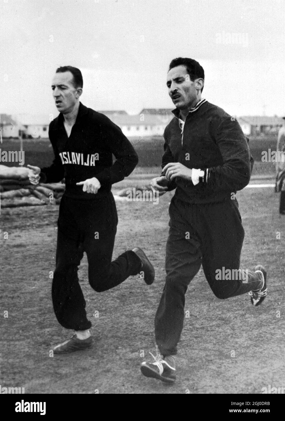 Alain Mimoun of France (right) 10,000m and marathon runner trains with ...