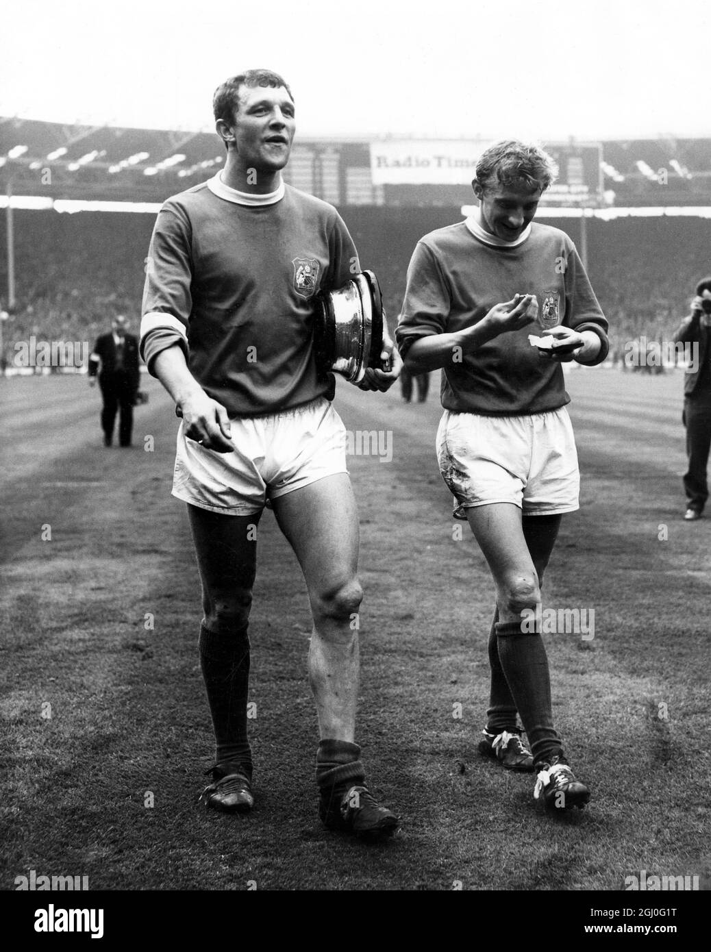 Manchester United players, David Herd and Dennis Law parade around ...