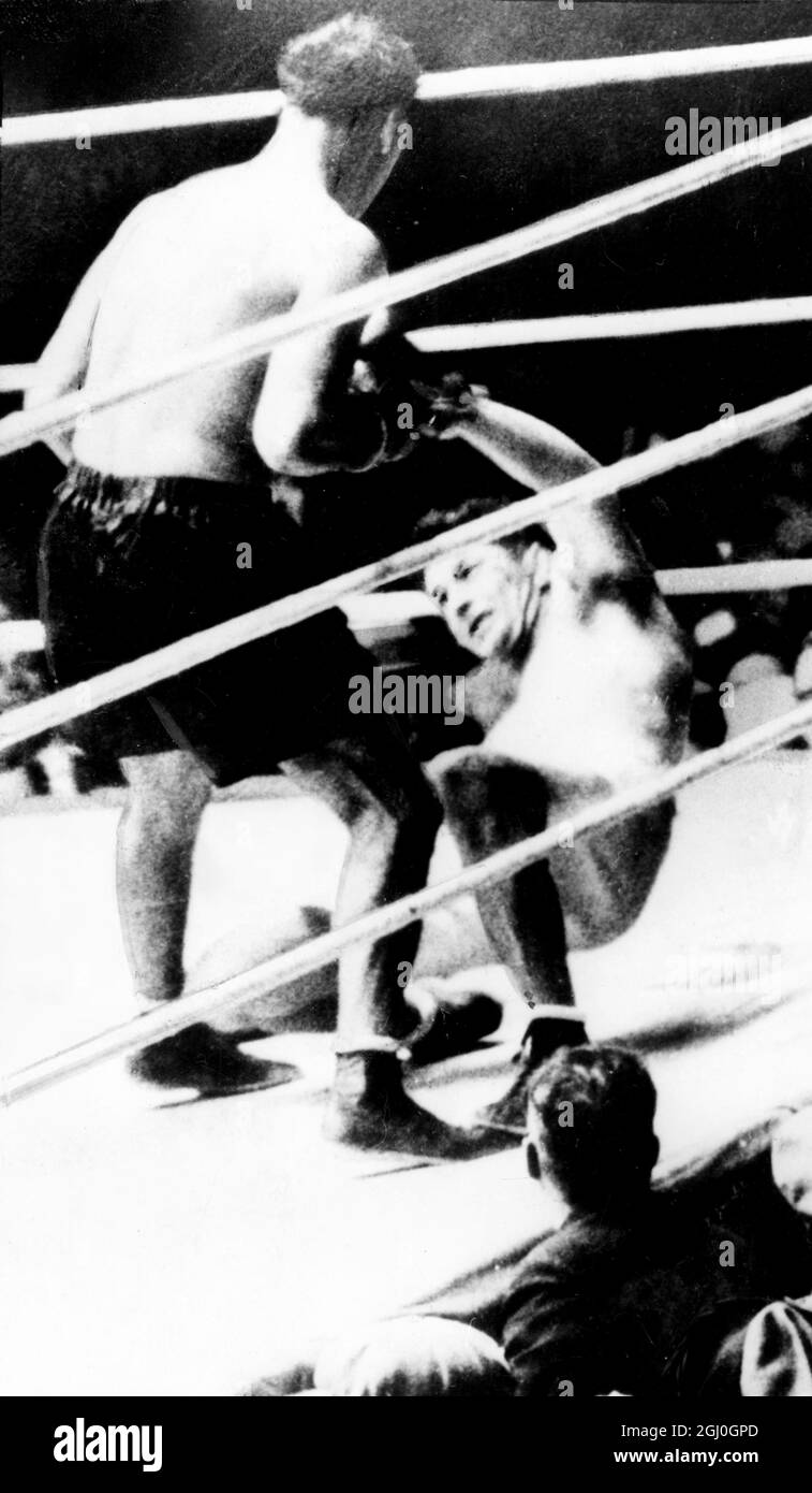 Jack Dempsey flooring Gene Tunney during their fight in America in 1927 ...
