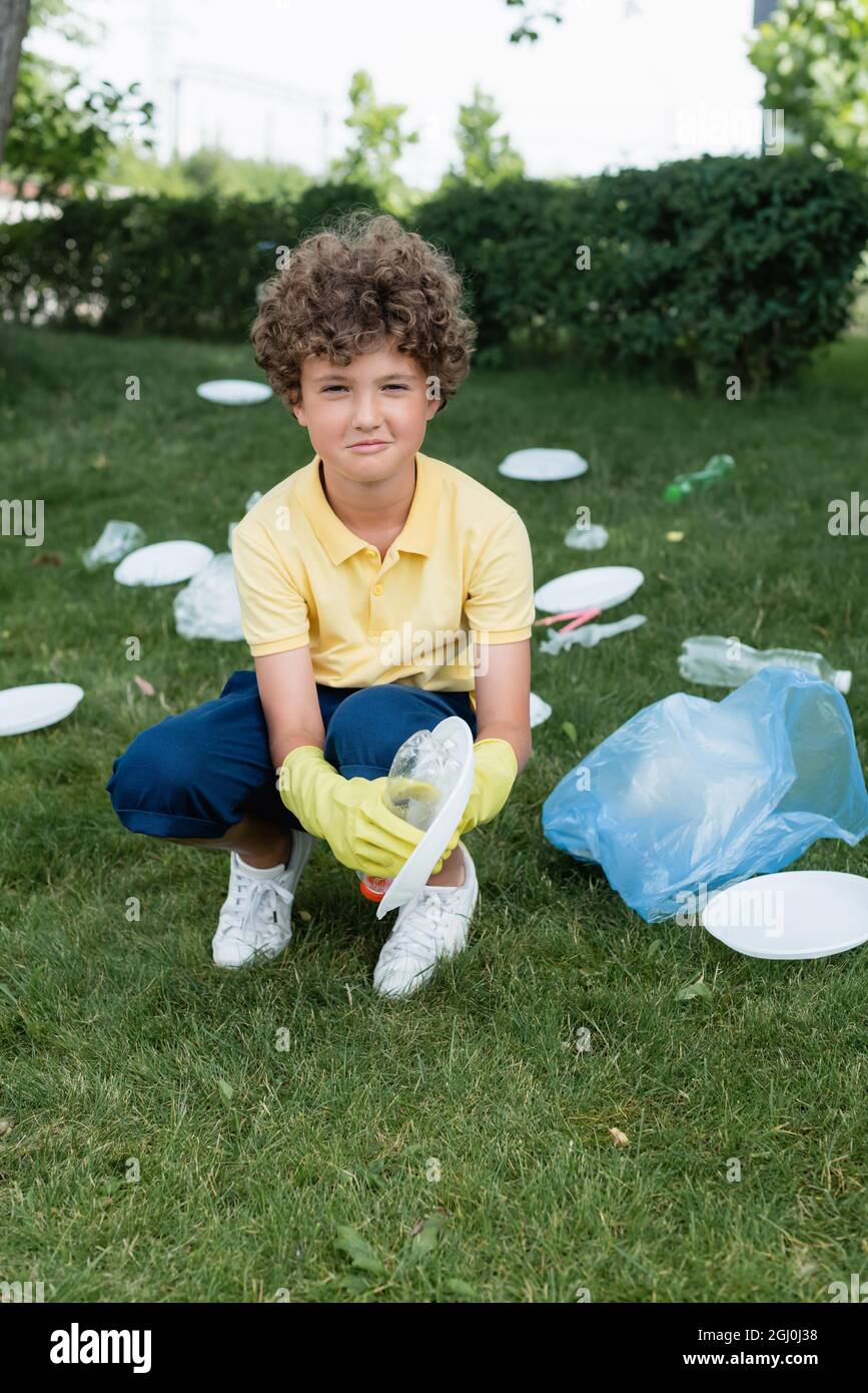 Child collecting garbage hi-res stock photography and images - Alamy