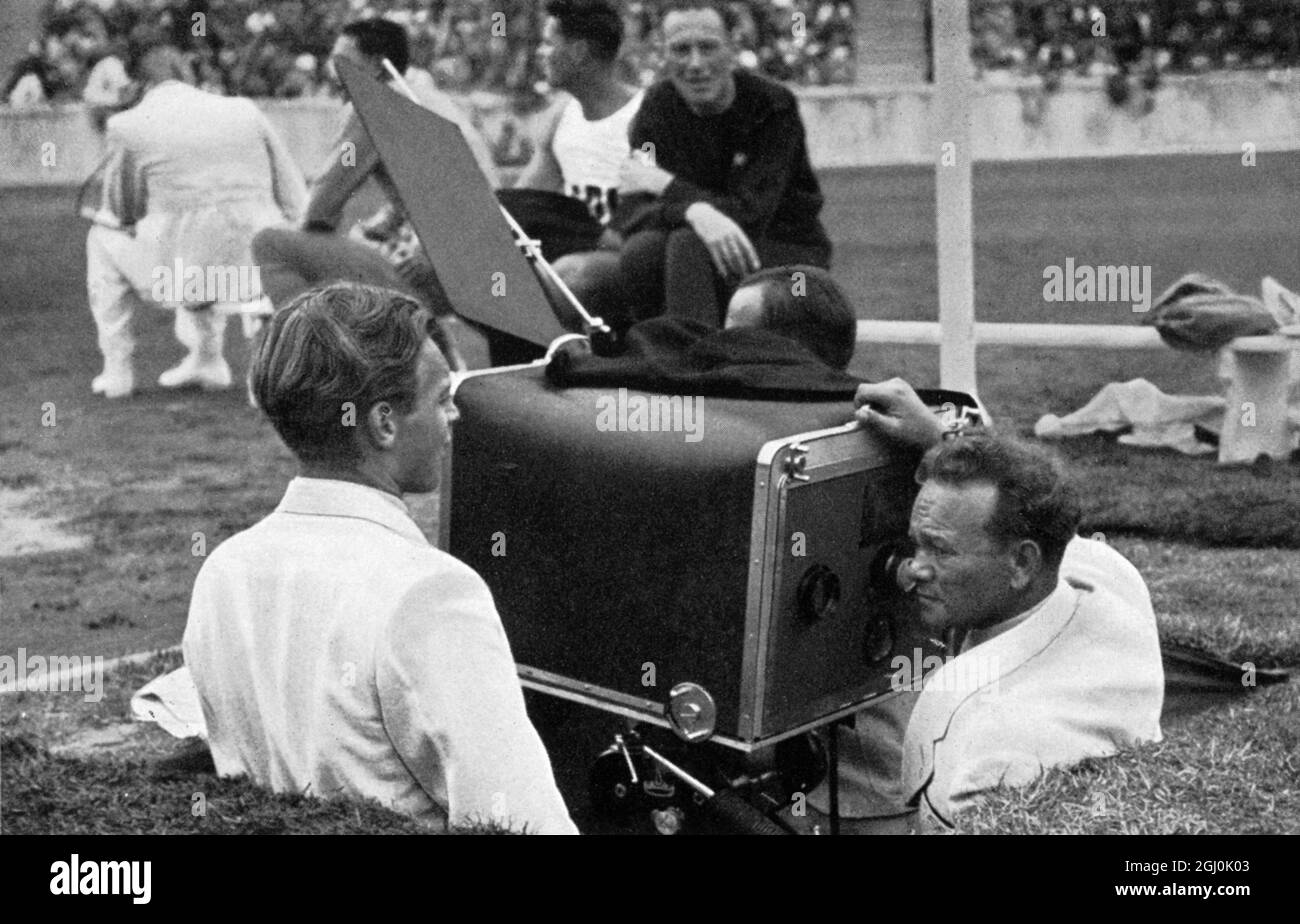 1936 Olympics, Berlin - The camera operator turns the large Olympic ...
