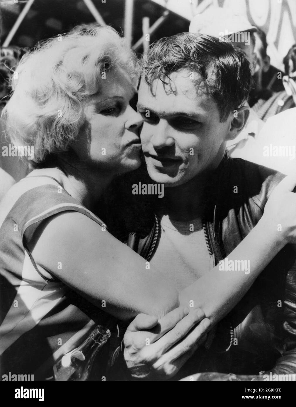 Rhodesia's Gary Hocking gets a victory hug in the paddock after winning ...