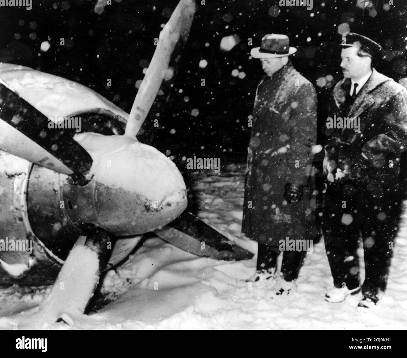 Two of the BEA crash investigation team inspecting one of the engines ...