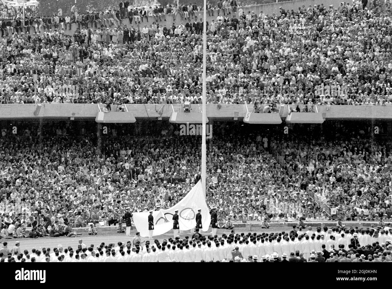 Mexico City: The hoisting of the official Olympic flag, at the opening ...