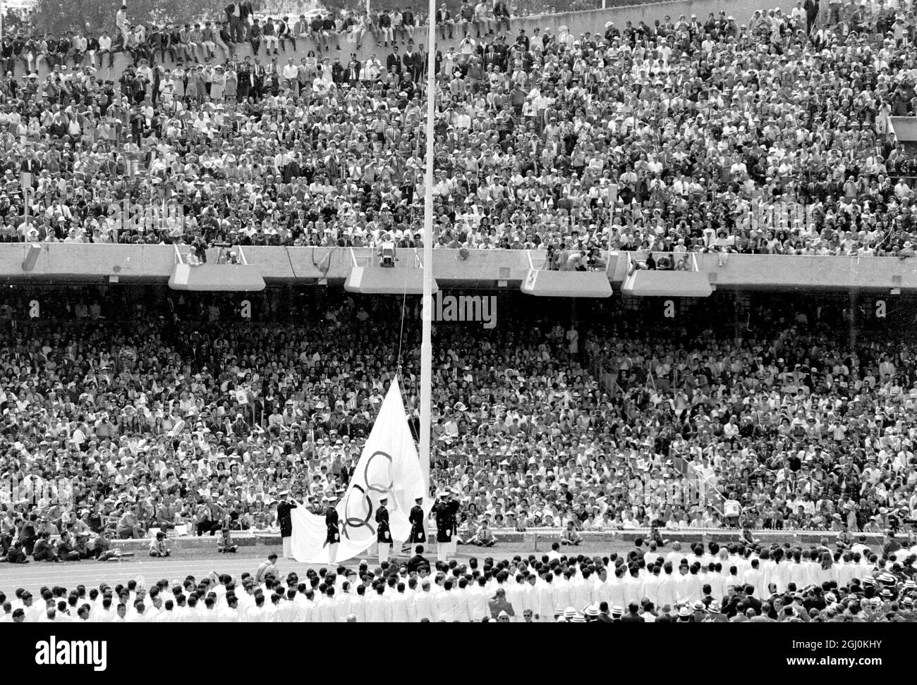 Mexico City: The hoisting of the official Olympic flag, at the opening ceremony of the 1968 ...