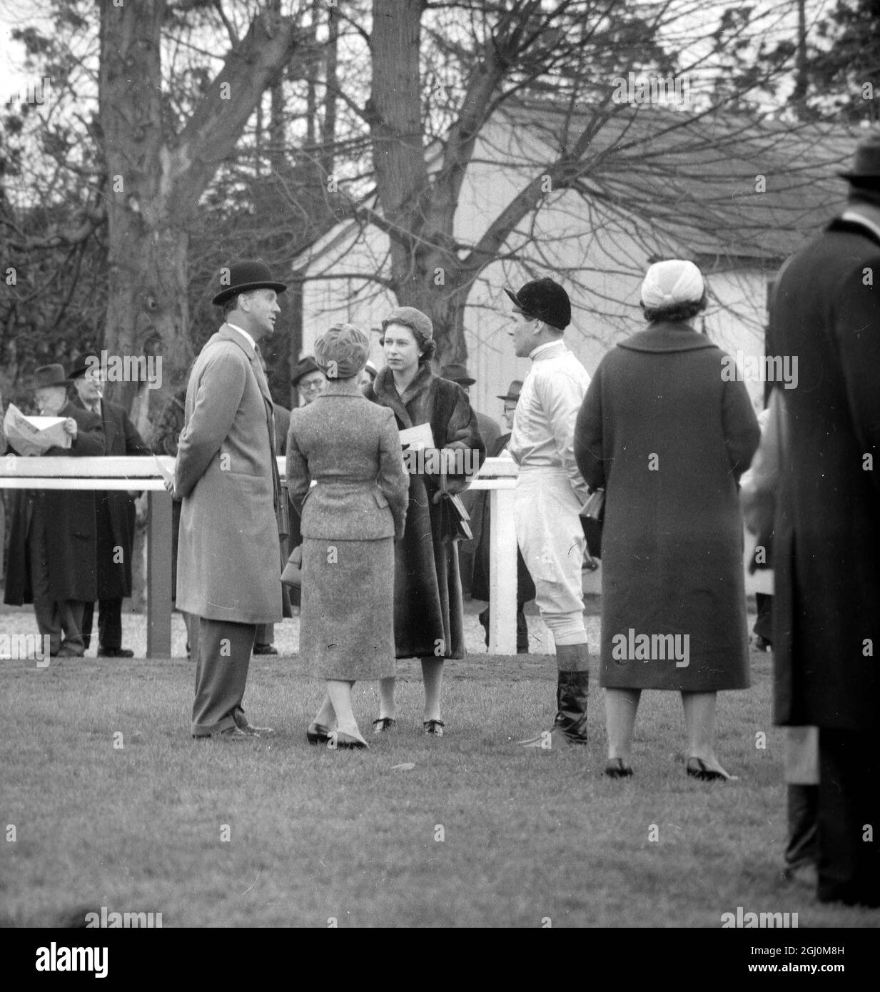 Queen Elizabeth and Princess Margaret back to camera talk to jocky A ...