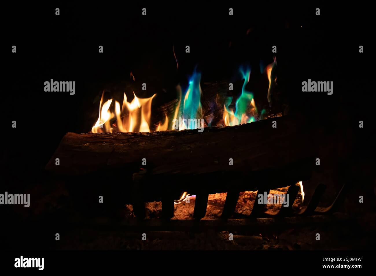 Colorful flames in a fireplace Stock Photo - Alamy