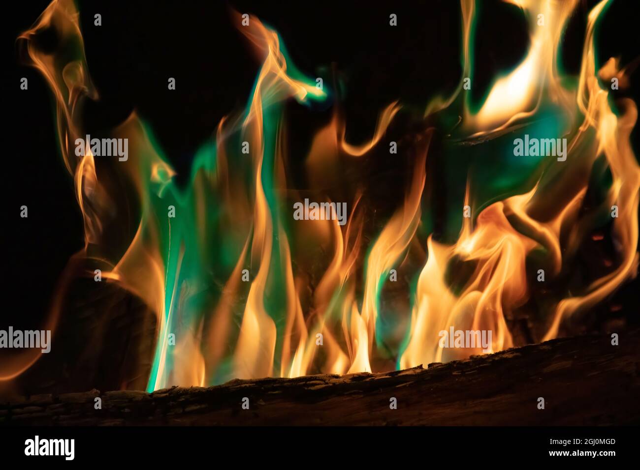 Colorful flames in a fireplace Stock Photo - Alamy