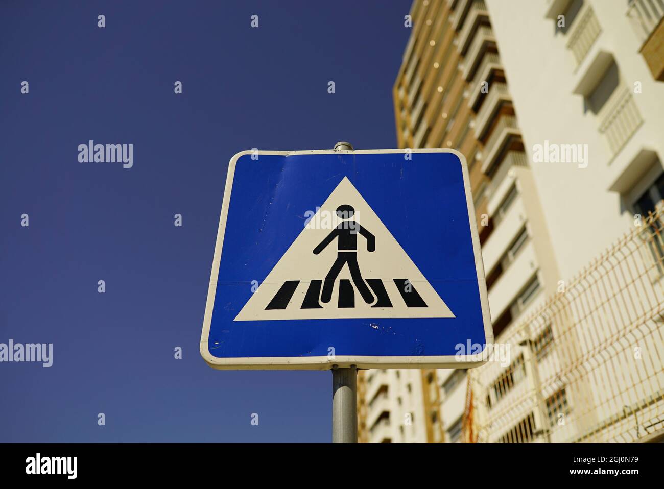 Low angle shot of a pedestrian crossing sign Stock Photo - Alamy