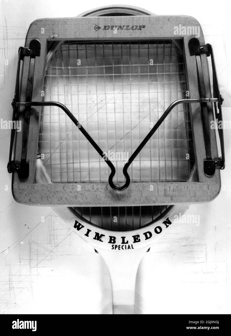 A wooden tennis racket with a press. Undated ©TopFoto Stock Photo - Alamy