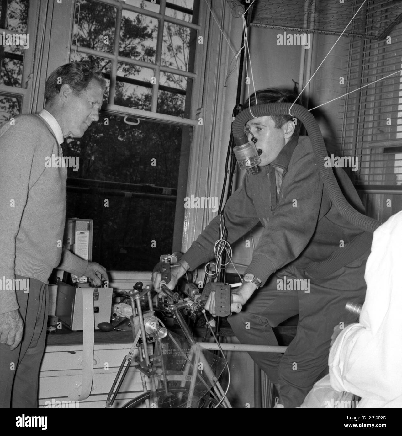 Athlete Martin Hyman huffs and puffs into the bicyclergometer as he ...