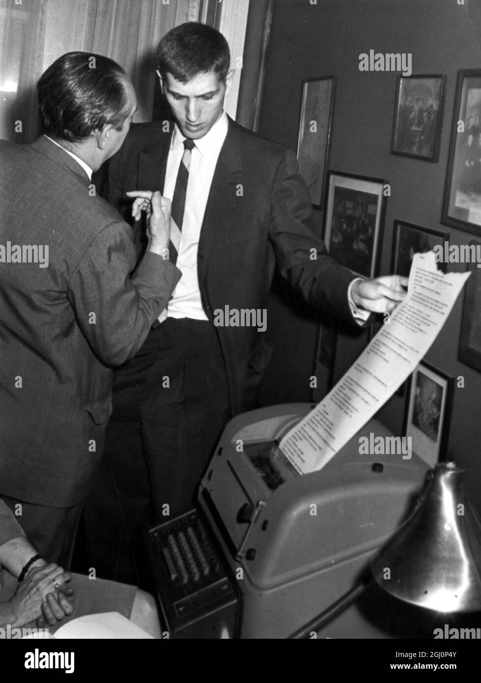 To play chess match by teletype. Bobby Fisher, 22-year-old American chess master, takes a look ...