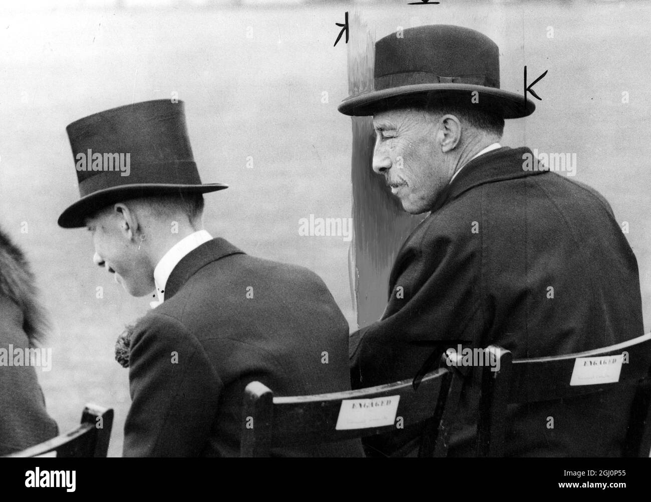 Lord Harewood and his son, Viscount Lascelles, watching the cricket at ...