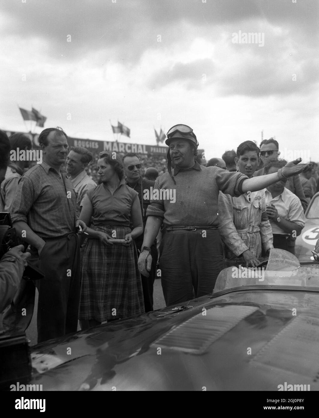 British Driver J Duncan Hamilton smiles and gestures after the victory ...