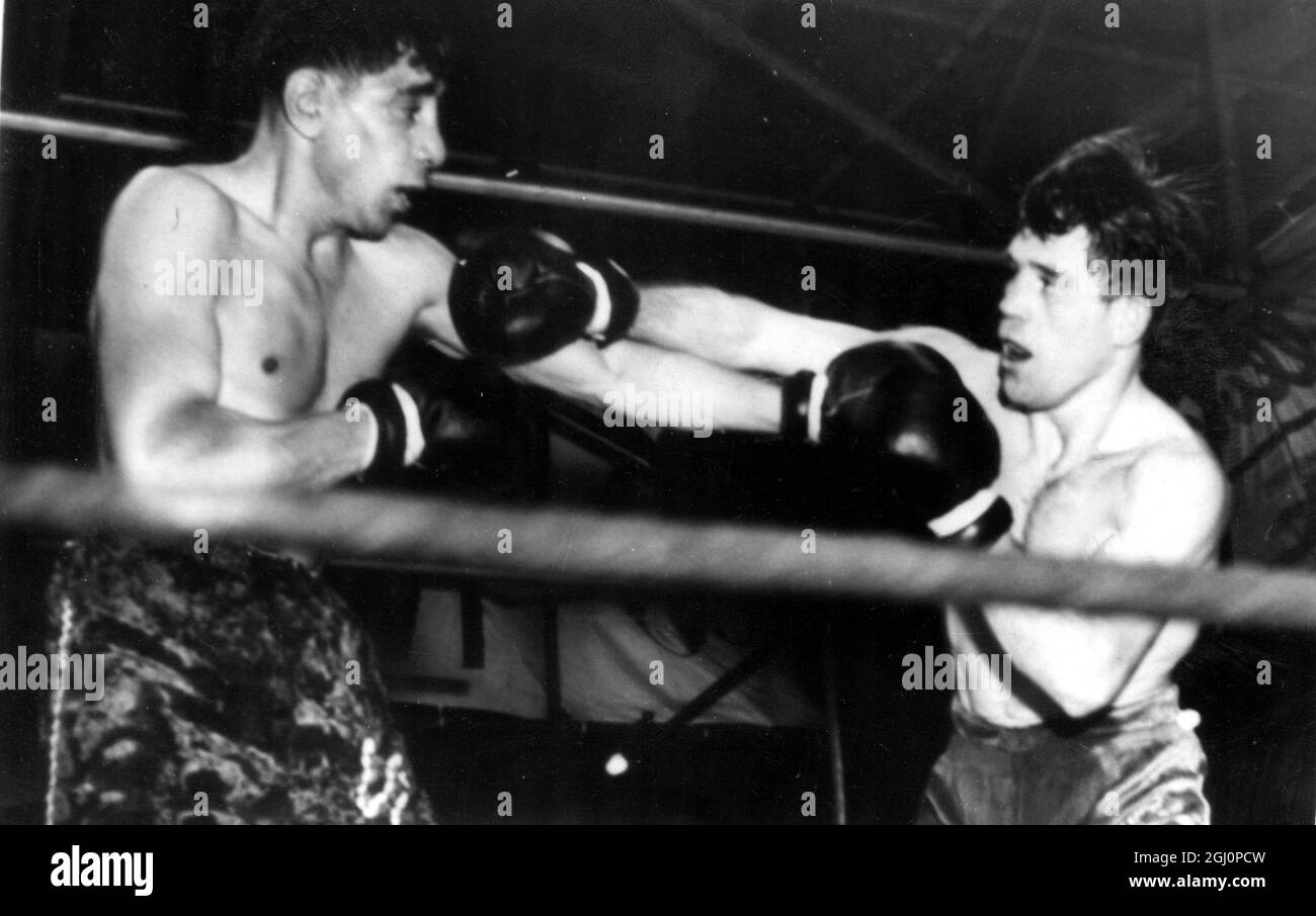 Vic Toweel , of South Africa (left) shoots out a long left as his ...