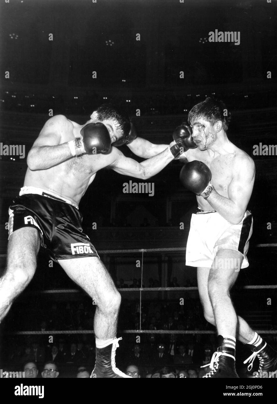 Jimmy Tibbs is seen with a cut eye during the fourth round of his 8 ...