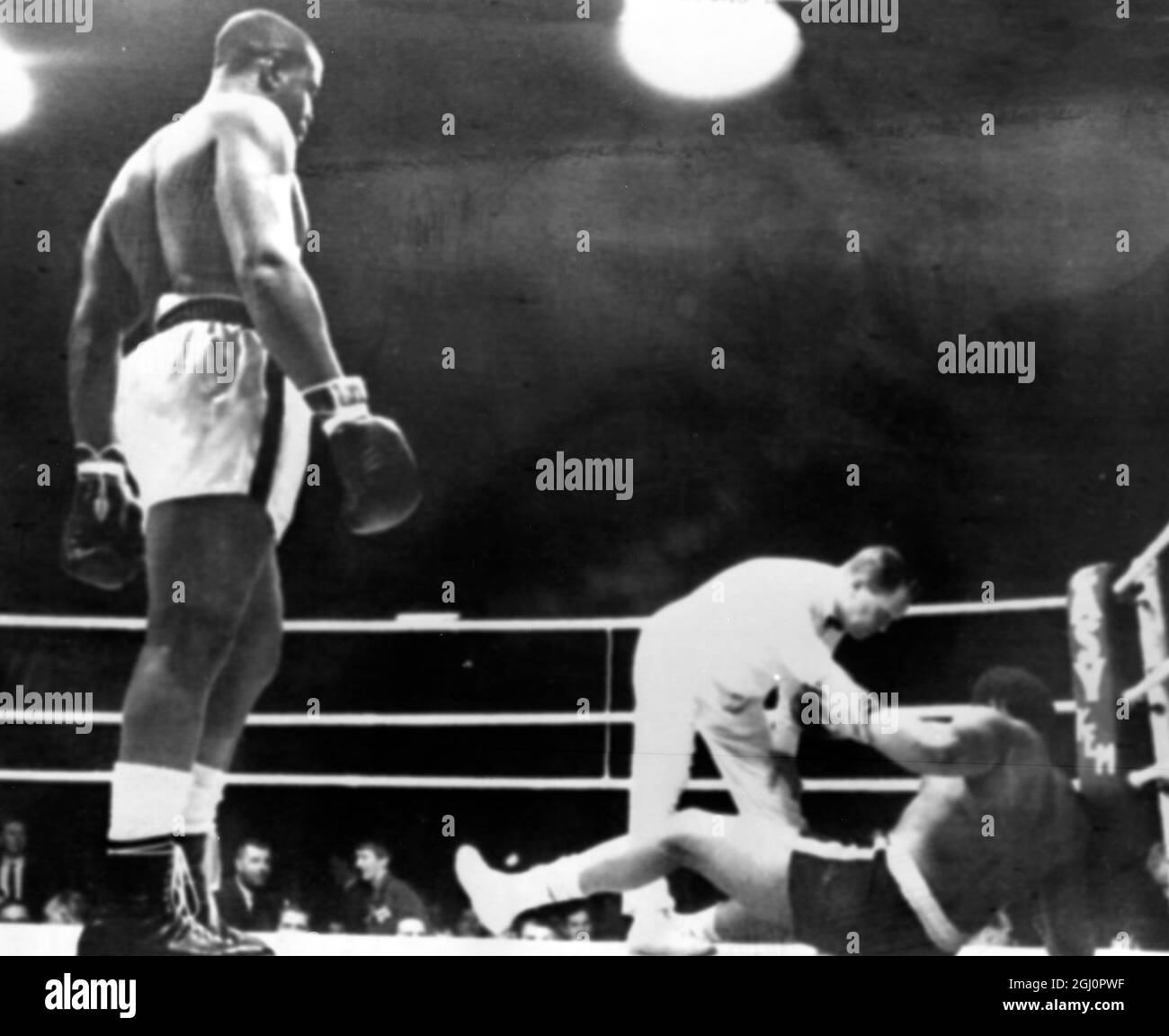 Former world heavyweight champion Sonny Liston stands calmly , arms by ...