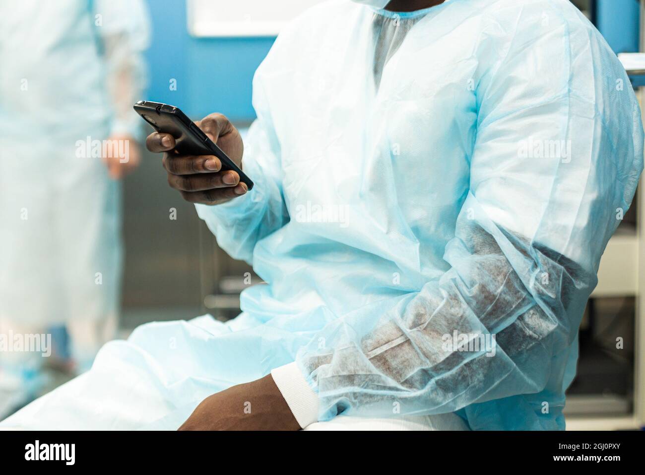 Portrait of a surgeon in uniform and medical mask after the operation ...