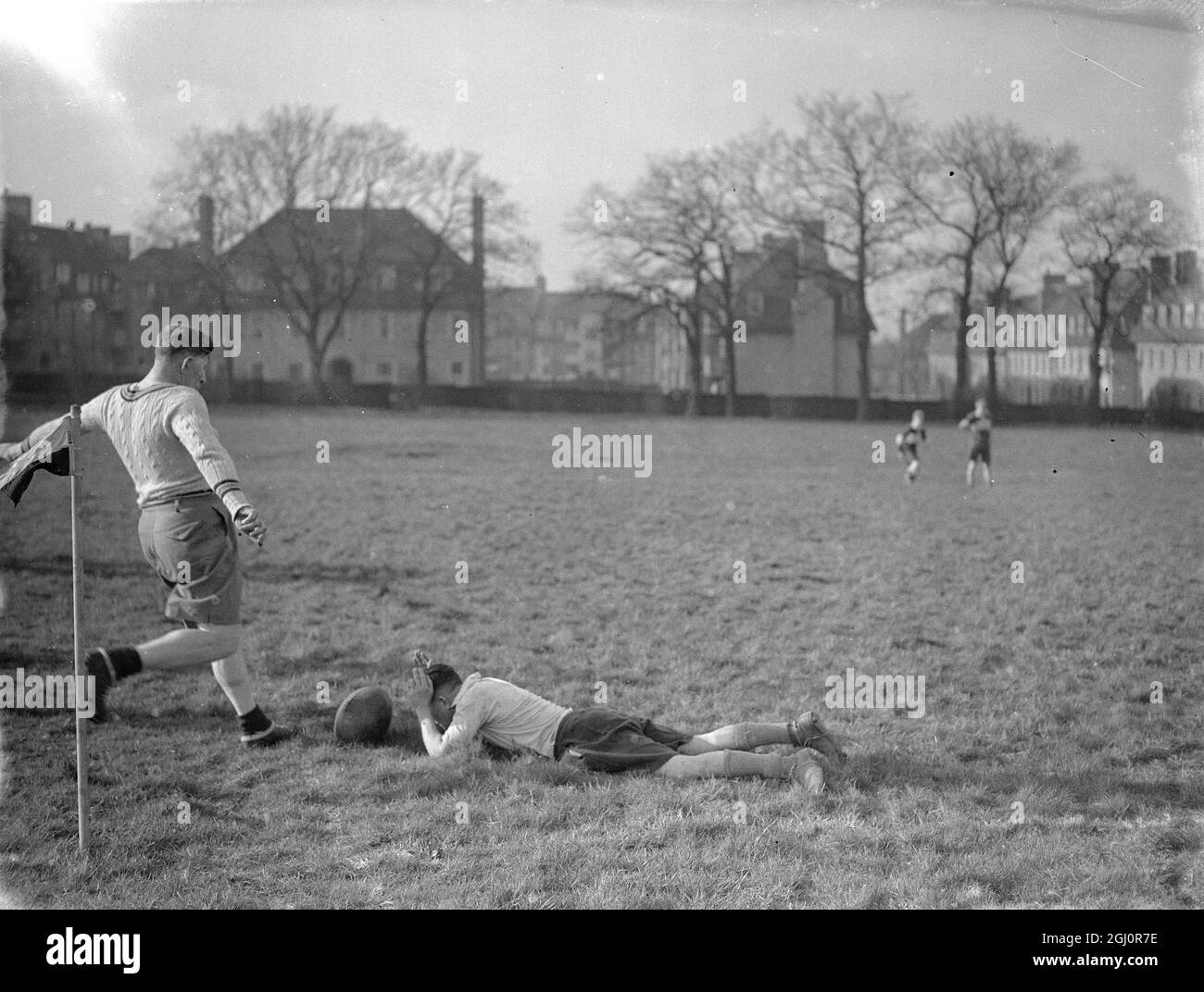 Kicking rugby ball Black and White Stock Photos & Images - Alamy