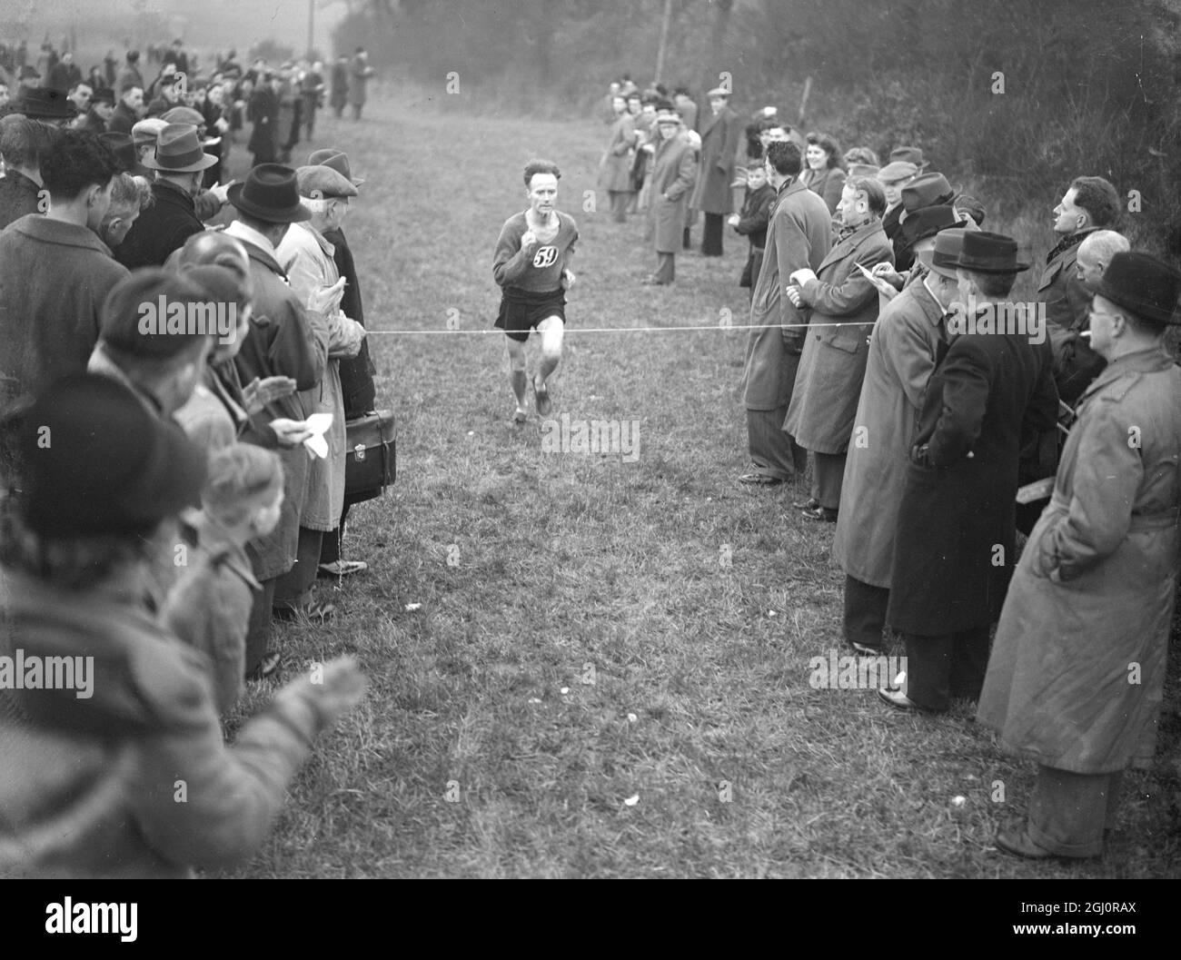 Cross country running race Crossing the finish line 1940 Stock Photo ...