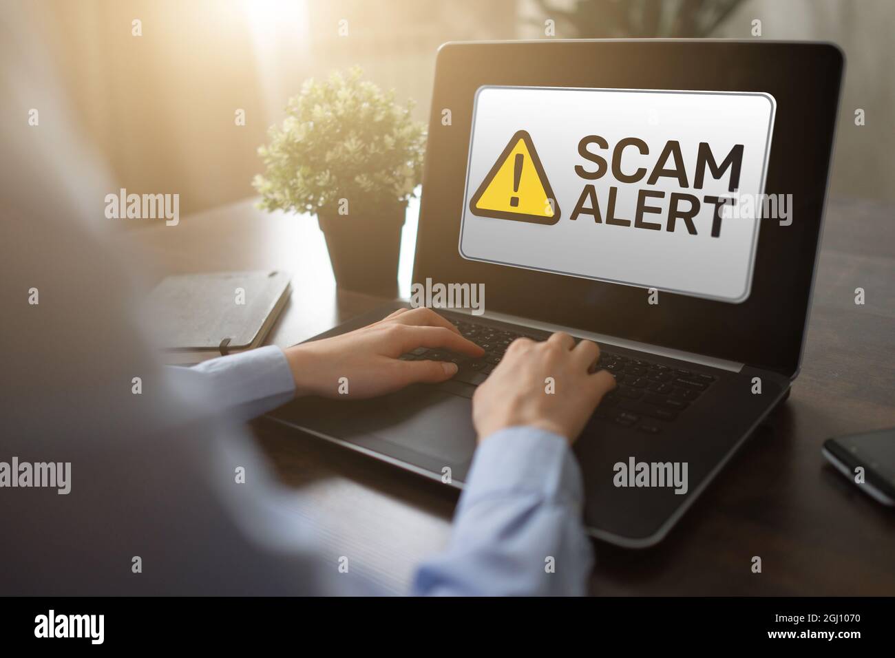 Scam alert detecting warning. Notification on device screen Stock Photo ...