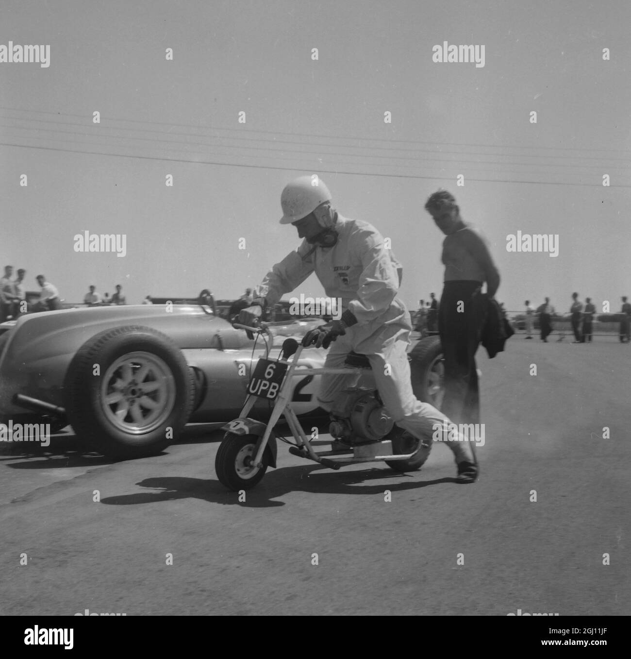 BRITISH RACING DRIVER STIRLING MOSS ON A SCOOTER AT SILVERSTONE - 6 ...